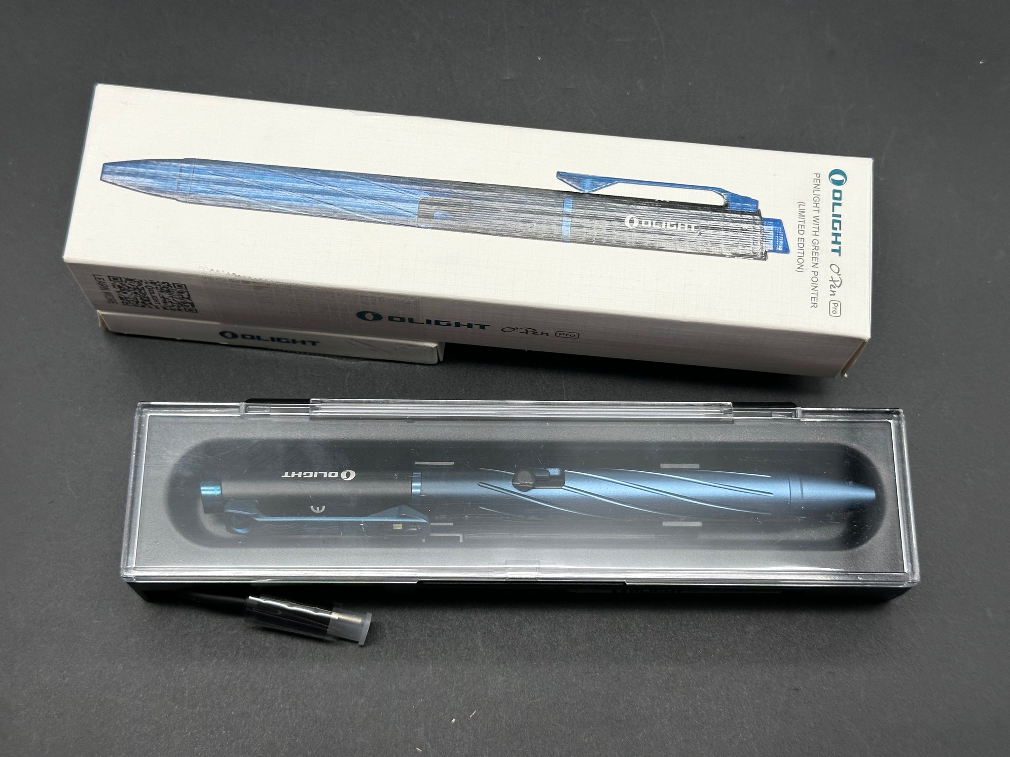 OLIGHT O'Pen Pro w/green laser pointer, 120 lumen light, and bolt-acti