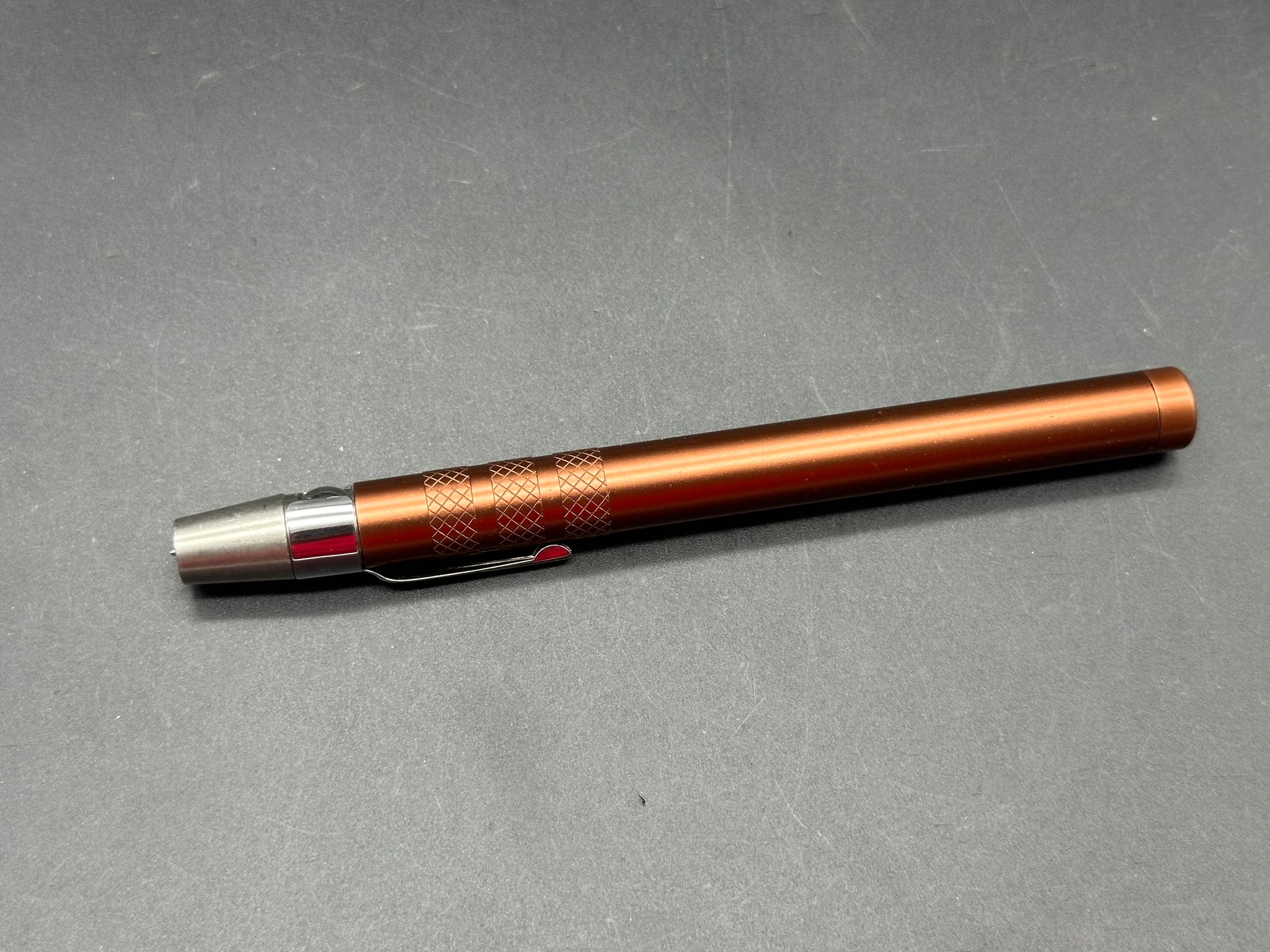 Spring loaded glass breaker / ice pick